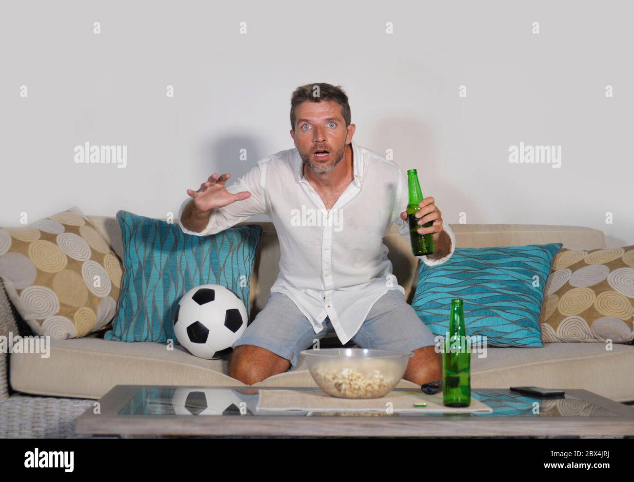 passionate football fan supporter man watching match on television ...