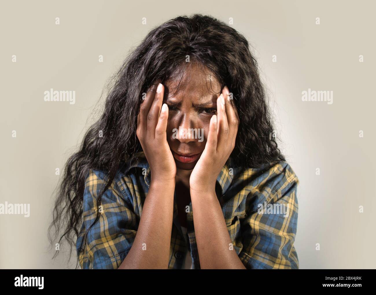 young sad and depressed black African American woman crying anxious and ...
