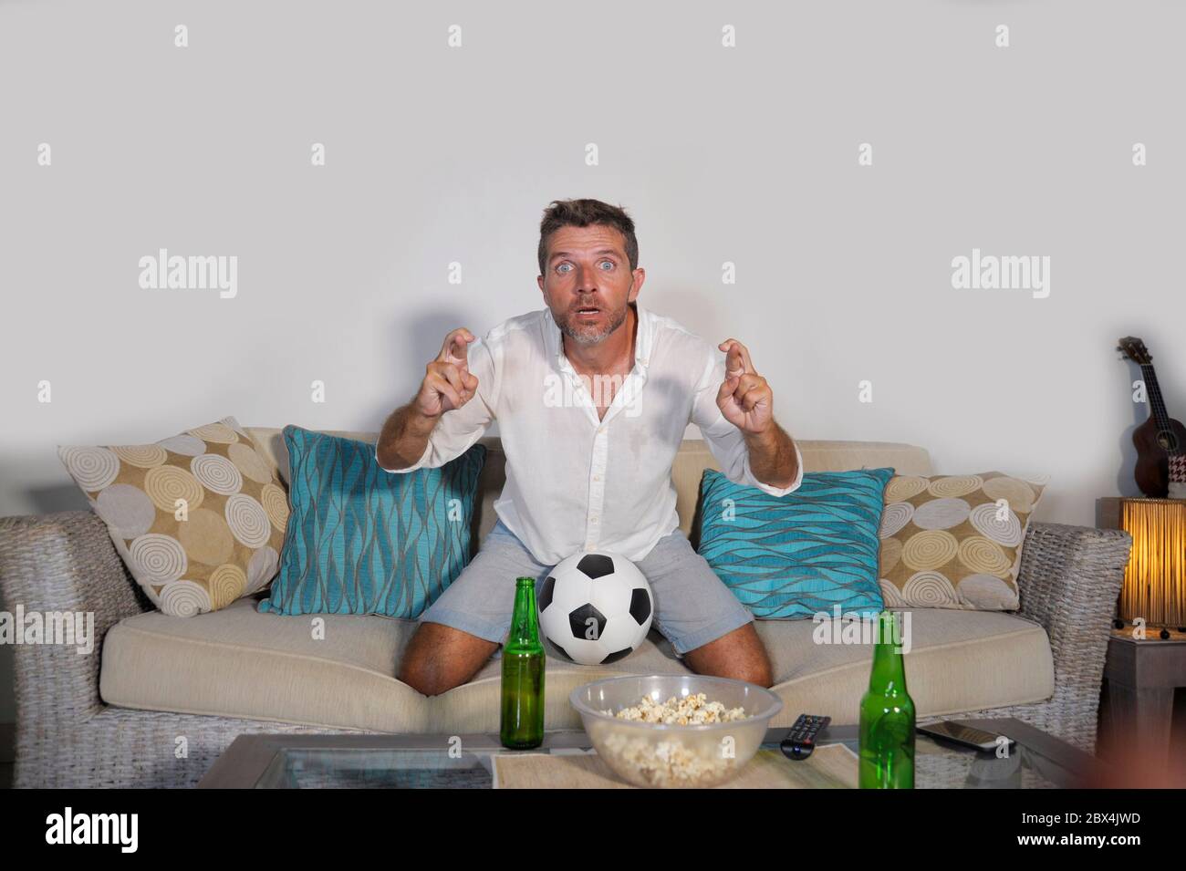 passionate football fan supporter man watching match on television ...