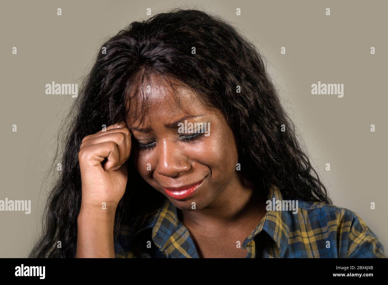 young sad and depressed black African American woman crying anxious and ...