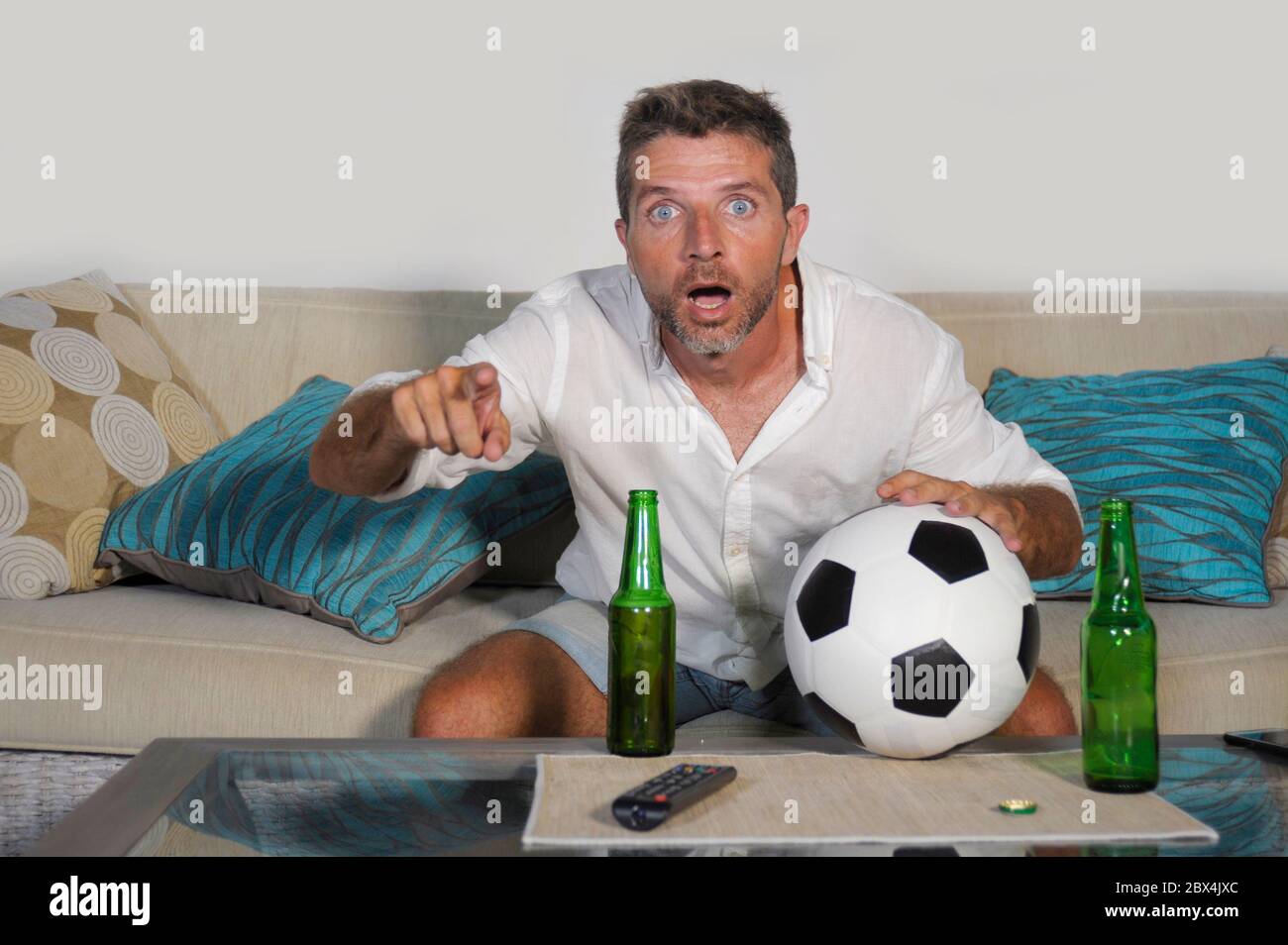 passionate football fan supporter man watching match on television ...