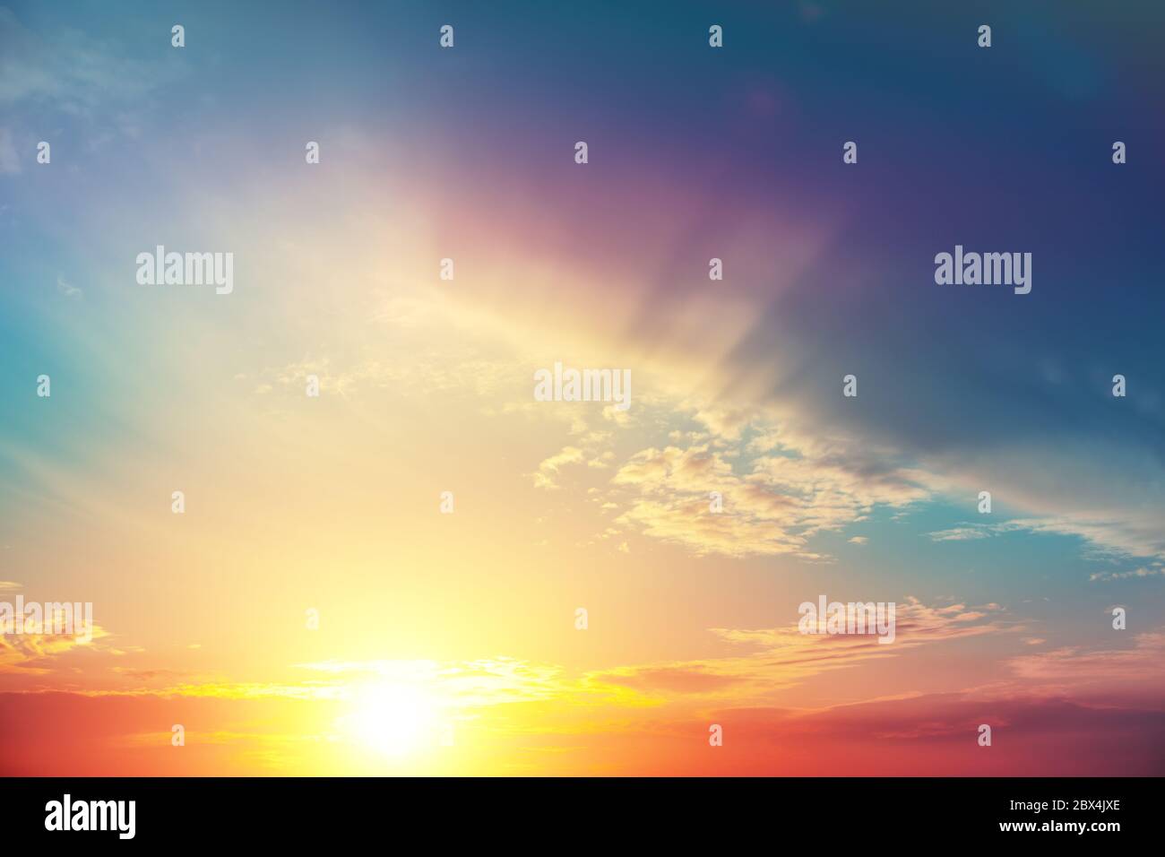 Colorful cloudy sky at sunset. Blazing sunset, gradient color. Sky ...