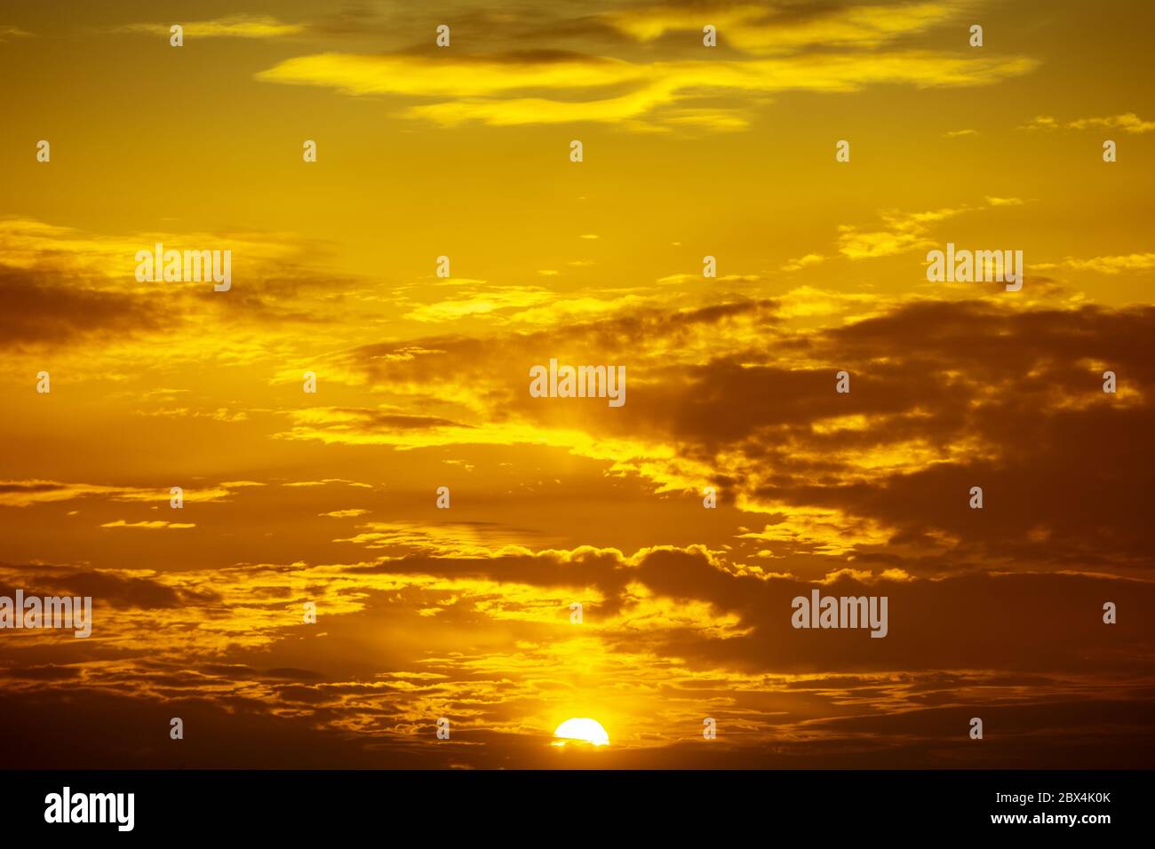 Colorful cloudy sky at sunset. Blazing sunset, gradient color. Sky ...