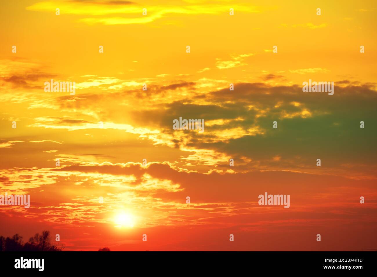 Colorful cloudy sky at sunset. Blazing sunset, gradient color. Sky ...