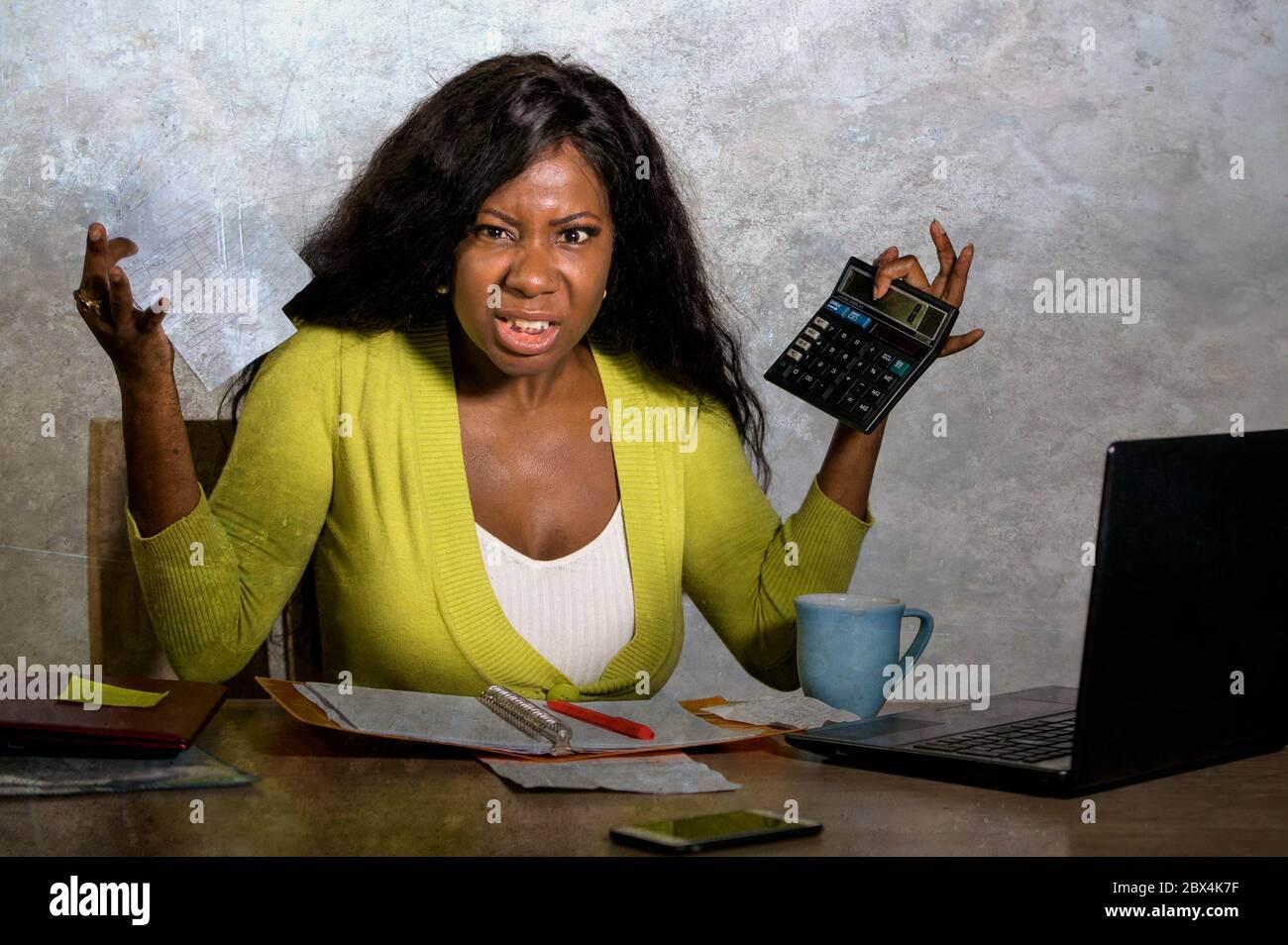 Young woman african american calculator hi-res stock photography and images - Alamy