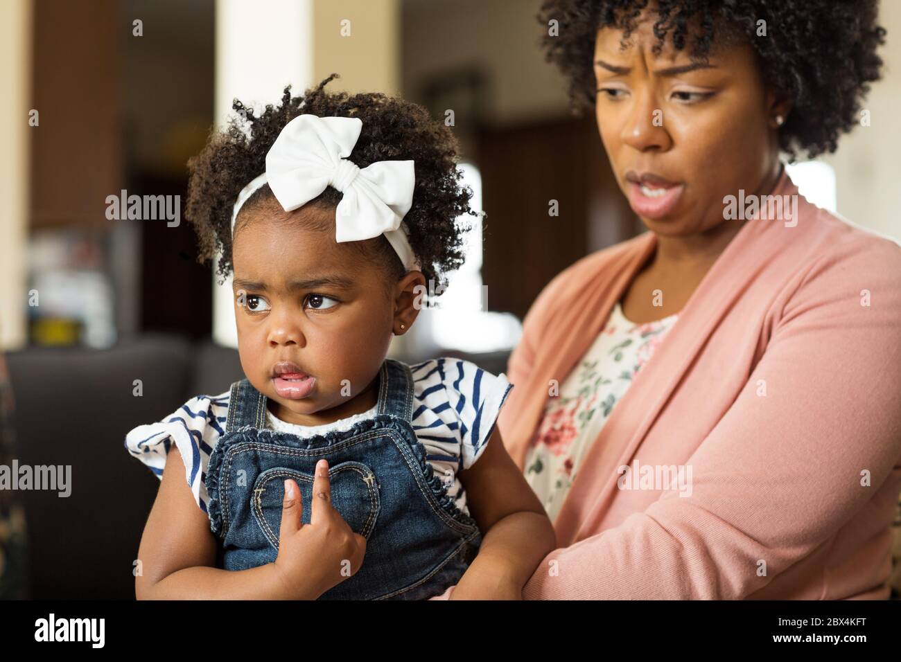 African American mother disciplining parenting her young child Stock ...