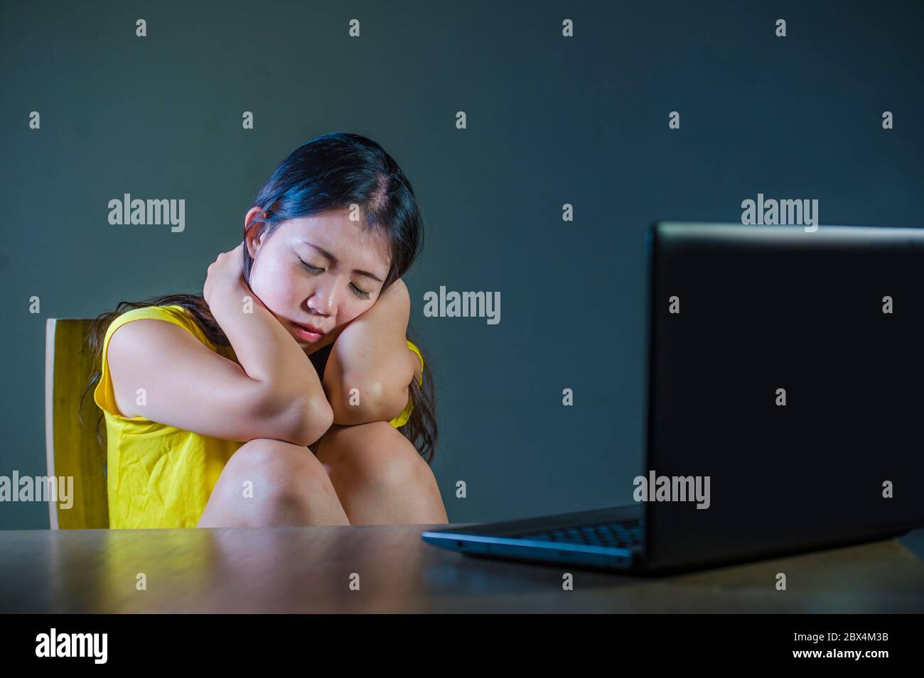 dramatic portrait of scared and stressed Asian Korean teenager girl or ...
