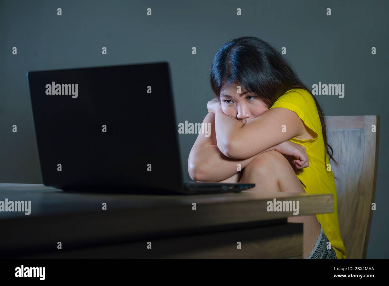 dramatic portrait of scared and stressed Asian Korean teenager girl or ...