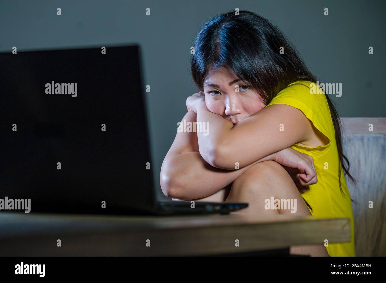dramatic portrait of scared and stressed Asian Korean teenager girl or ...