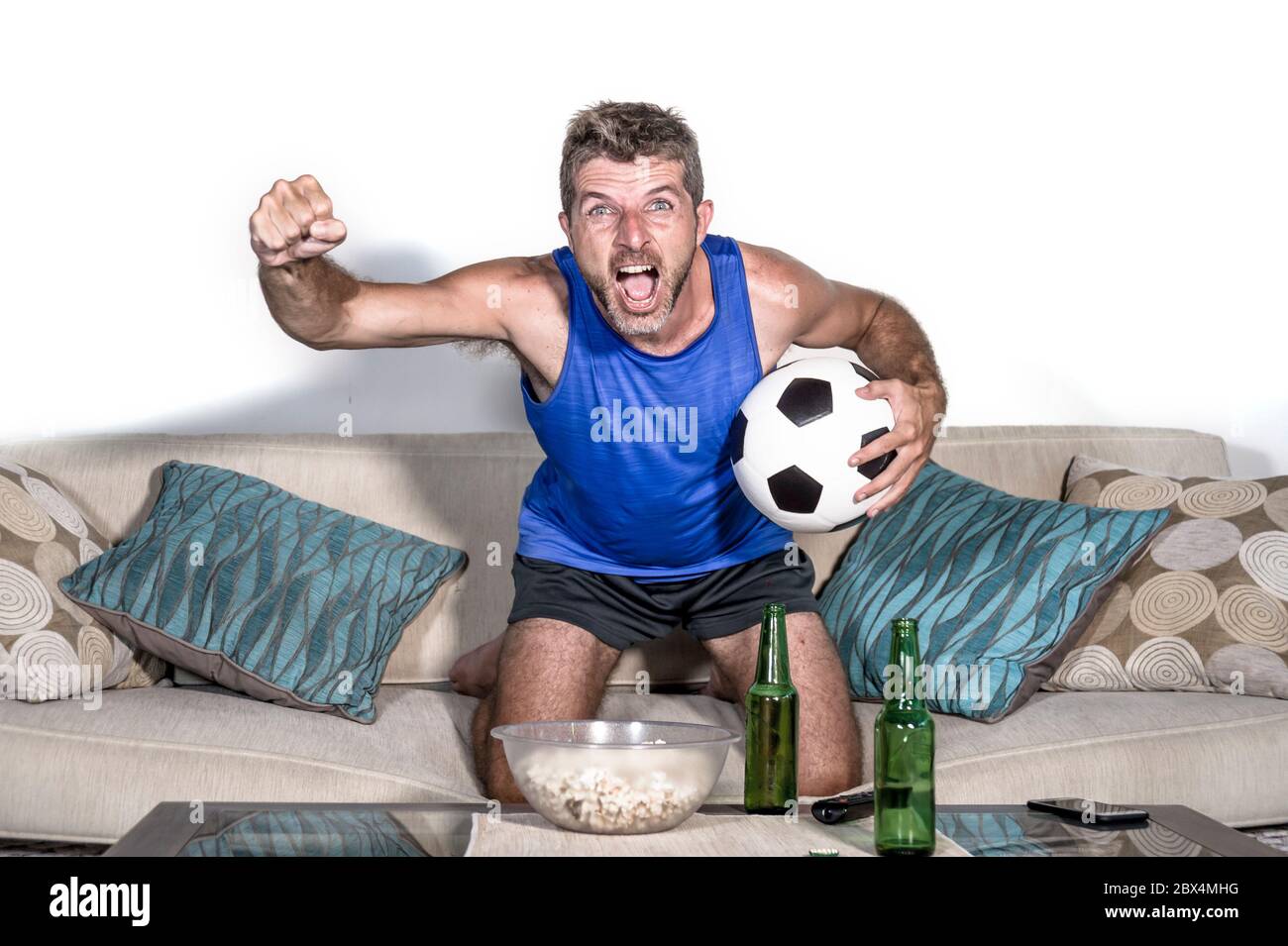 Man watching football tv hi-res stock photography and images - Alamy