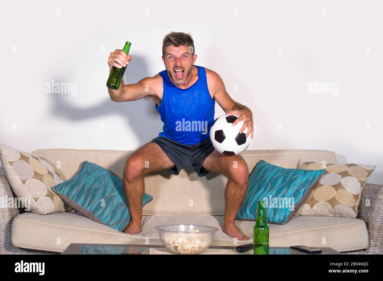 Man watching football tv hi-res stock photography and images - Alamy