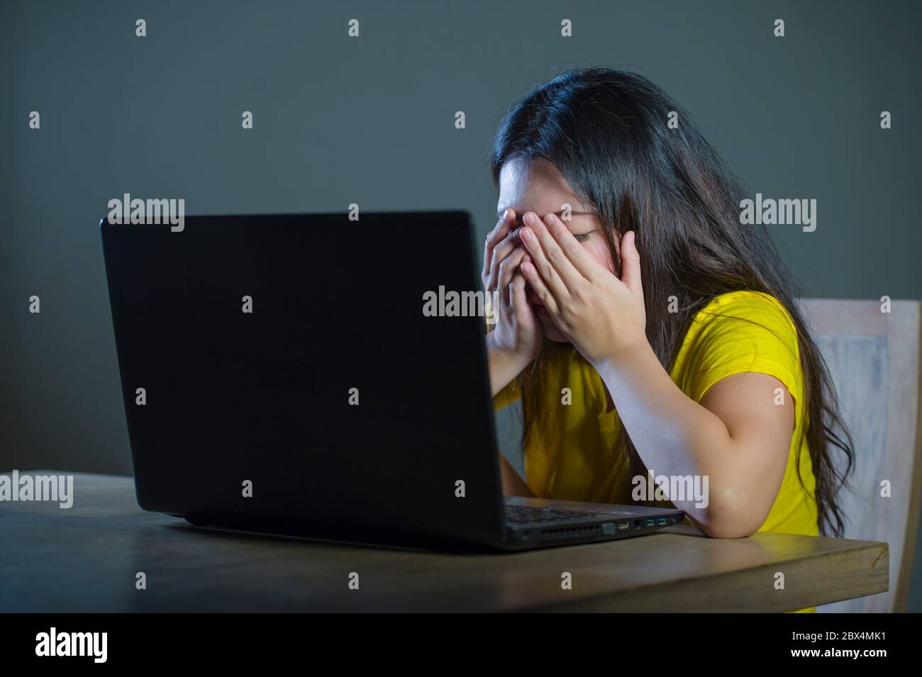 dramatic portrait of young sad and scared woman covering face with ...