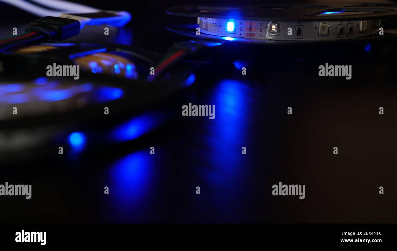 Diode strip for decoration of interiors. Led lights tape. Blue color on ...