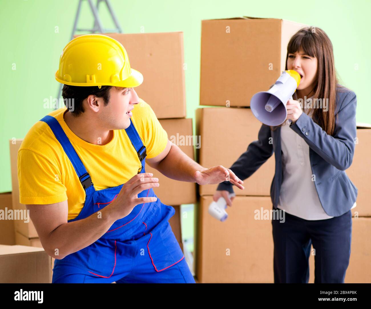The woman boss and man contractor working with boxes delivery Stock ...