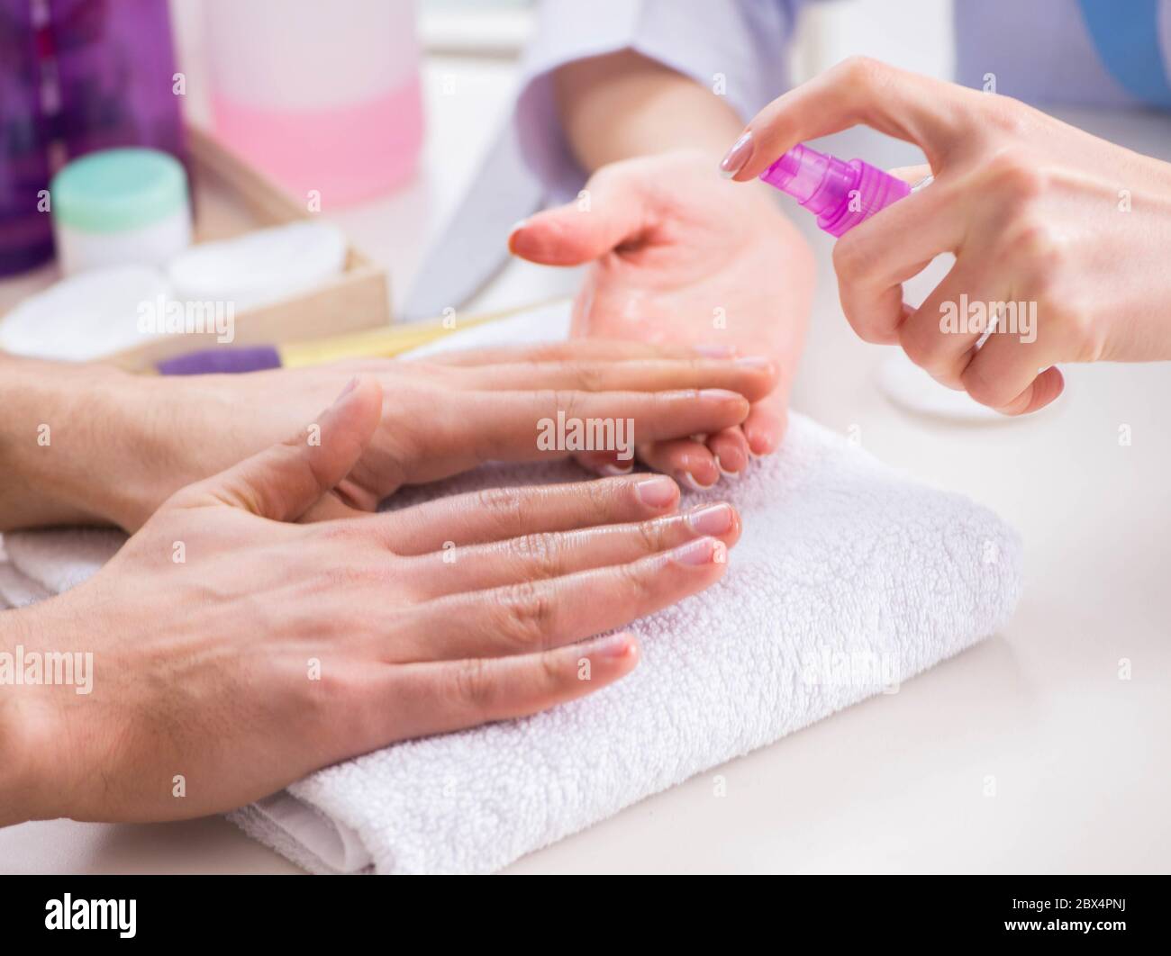 The hands during manicure care session Stock Photo - Alamy
