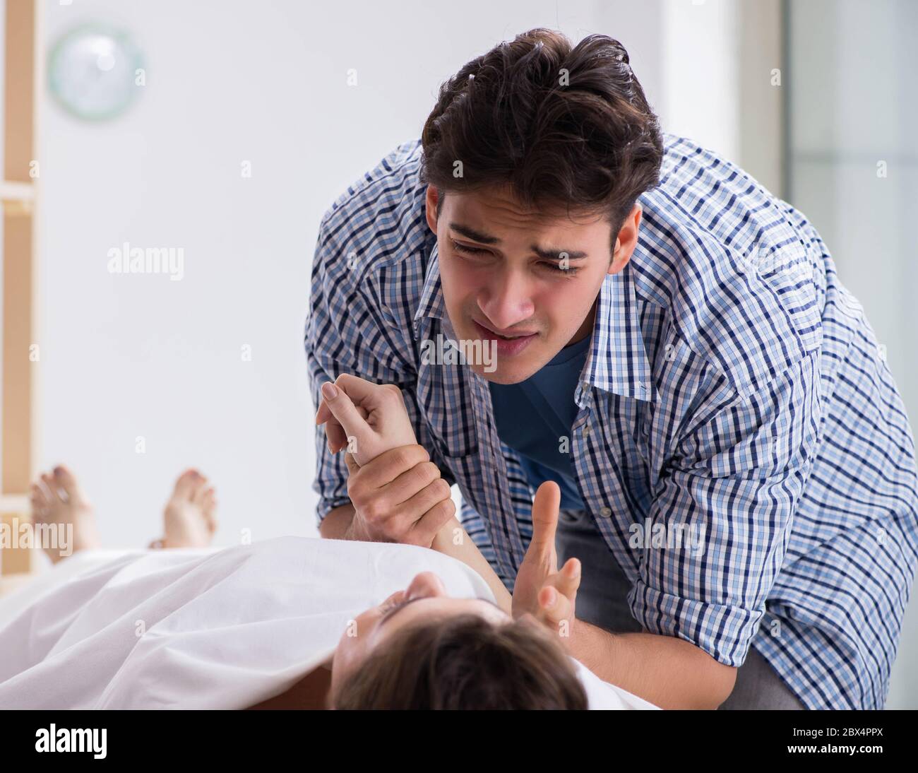 The man mourning his dead wife Stock Photo - Alamy