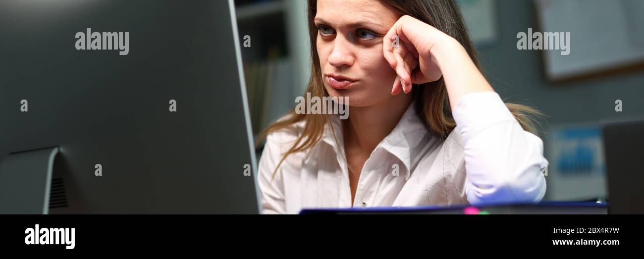 Pretty overworked woman at workplace Stock Photo - Alamy