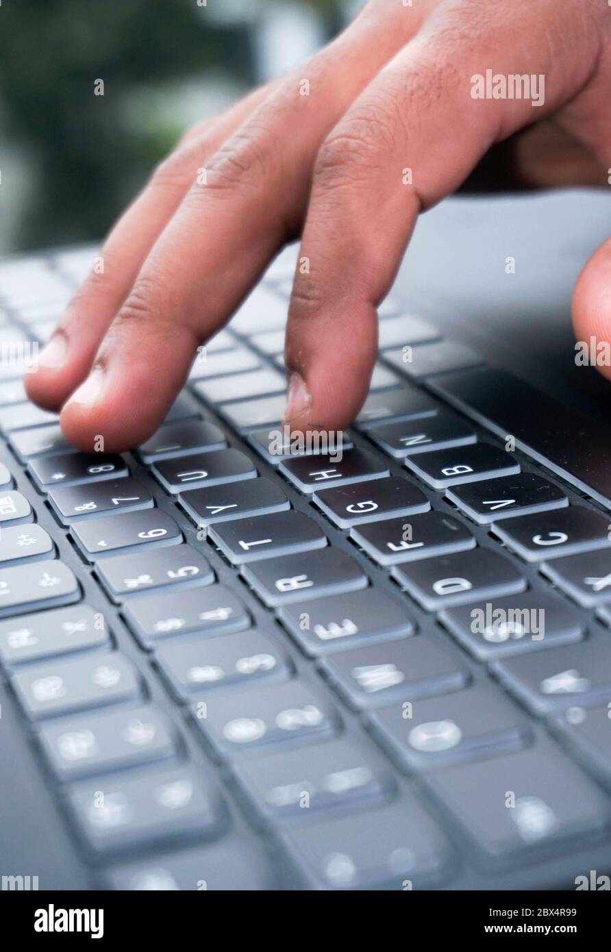 close up of a hand typing on a keyboard Stock Photo - Alamy