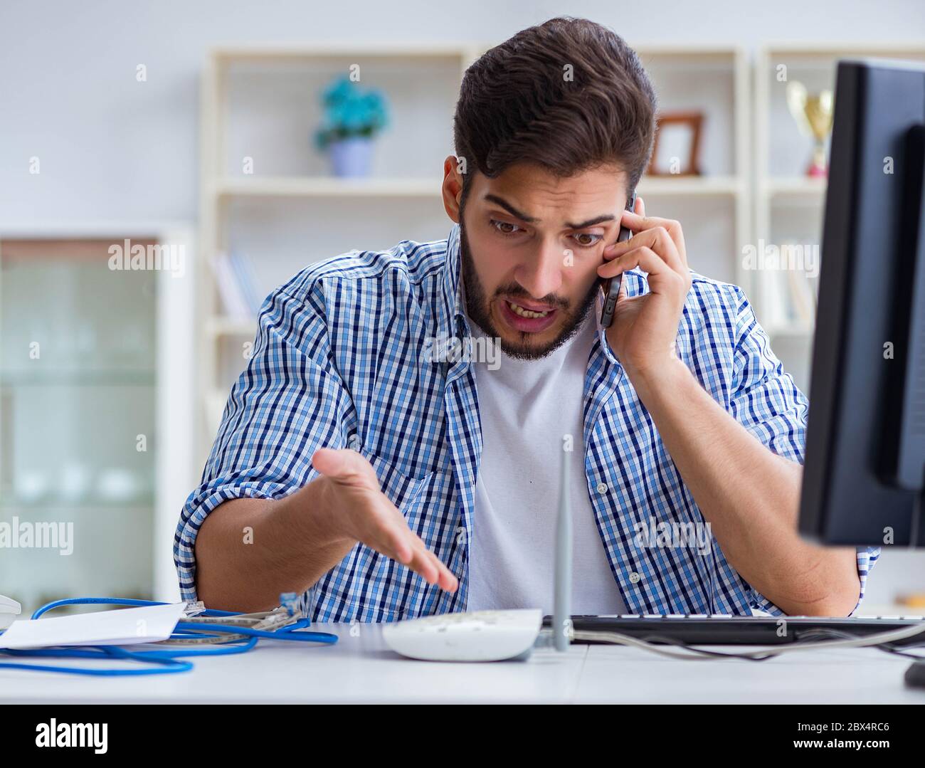 The frustrated young man due to weak internet reception Stock Photo - Alamy