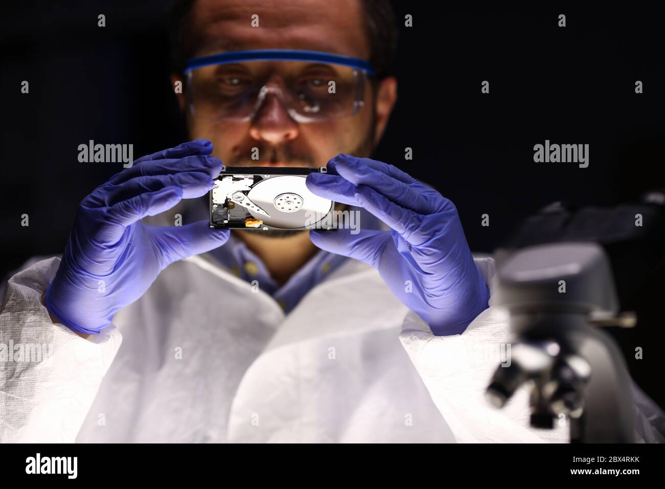 Computer master holding hdd Stock Photo - Alamy