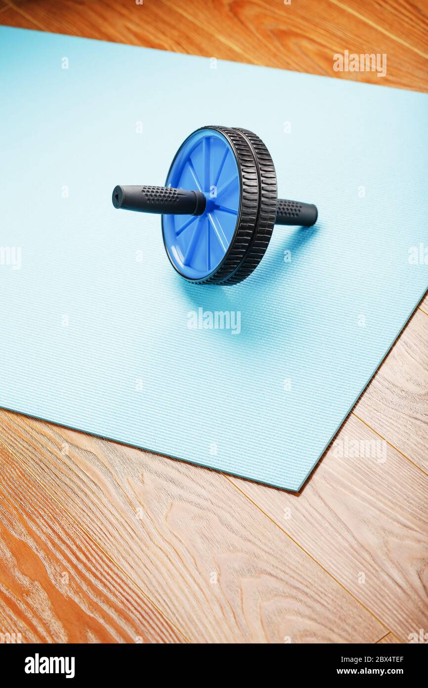 Sports roll for training muscles and abs on the blue Mat Stock Photo ...
