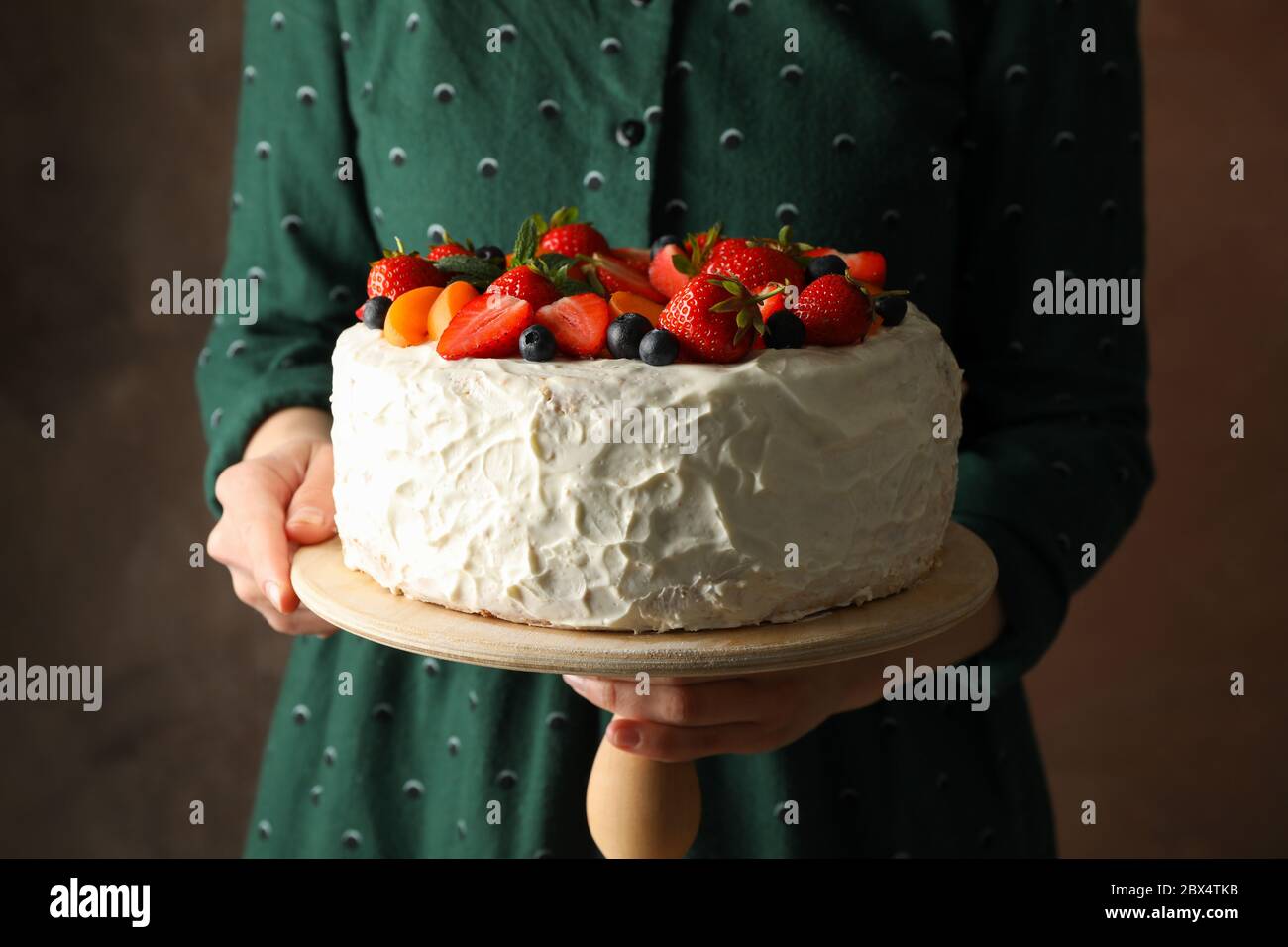 Woman holds plate cake hi-res stock photography and images - Alamy