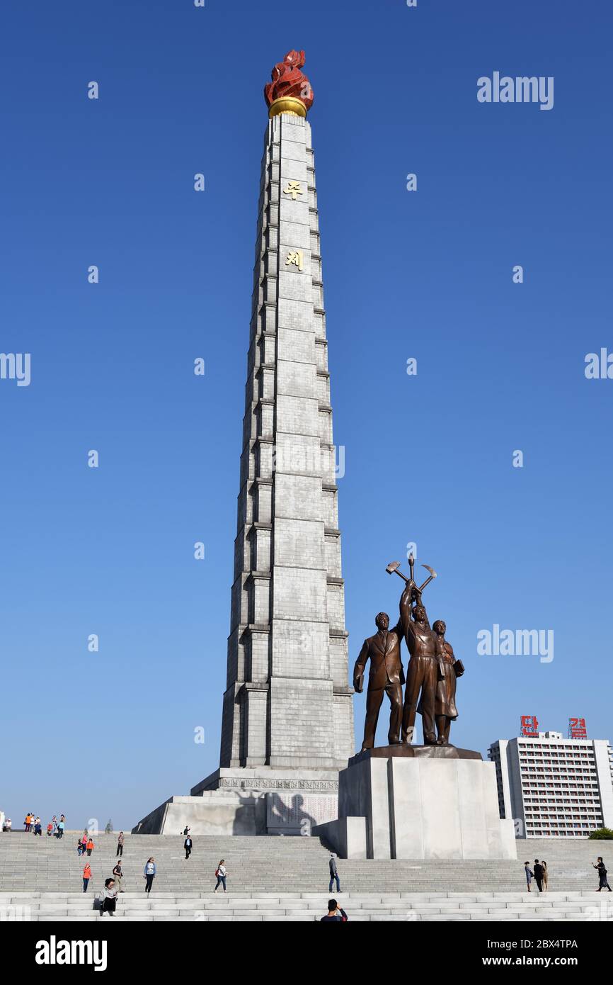 Pyongyang, North Korea - May 1, 2019: Tourists nearby Tower of the ...