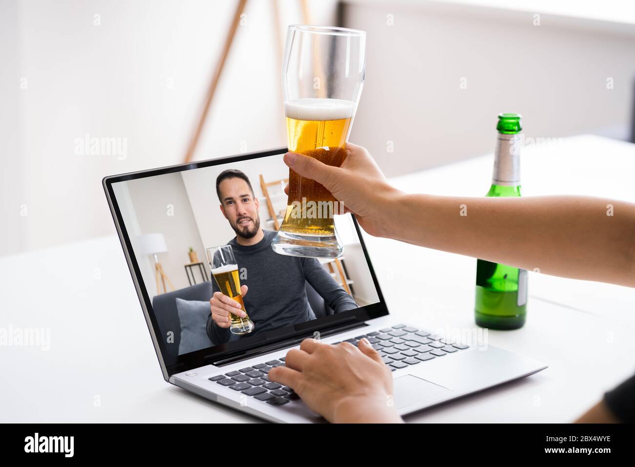 Online Virtual Beer Drinking Party On Laptop Stock Photo - Alamy