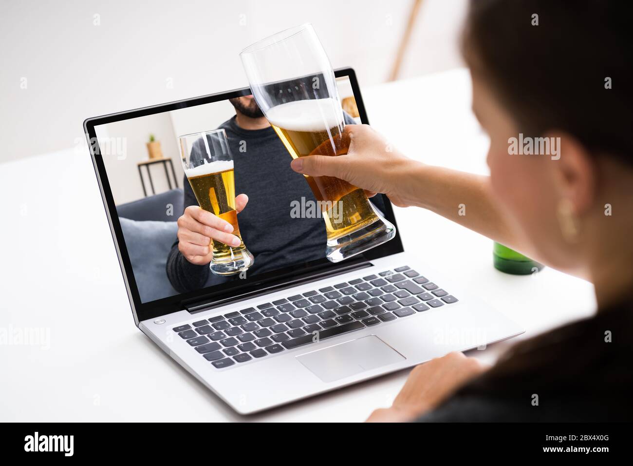 Online Virtual Beer Drinking Party On Laptop Stock Photo - Alamy