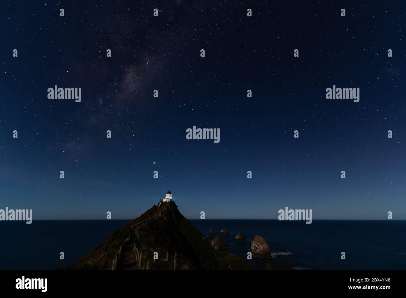 Starry night at Nugget Point Lighthouse, New Zealand, under the Milky ...
