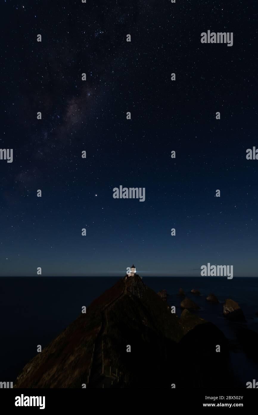 Starry night at Nugget Point Lighthouse, New Zealand, under the Milky ...