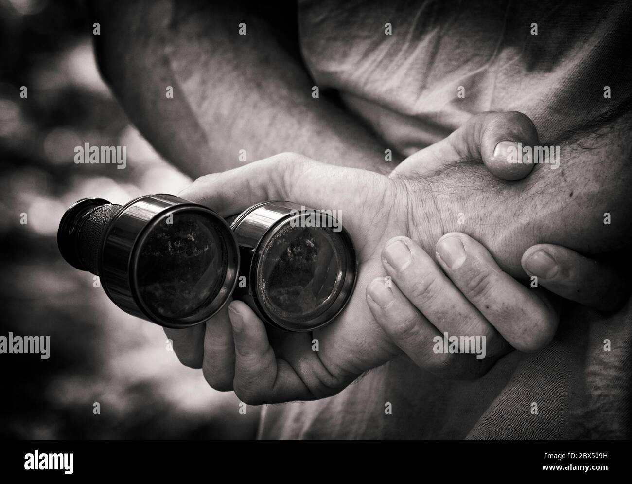 Man binoculars spying hi-res stock photography and images - Alamy