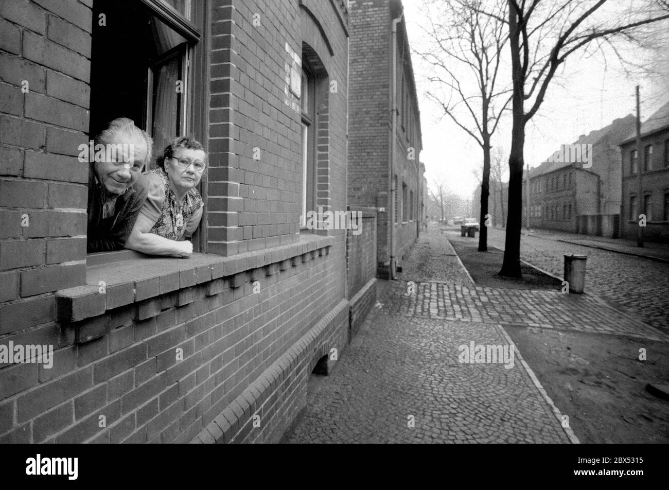 Old couple looking out window Black and White Stock Photos & Images - Alamy