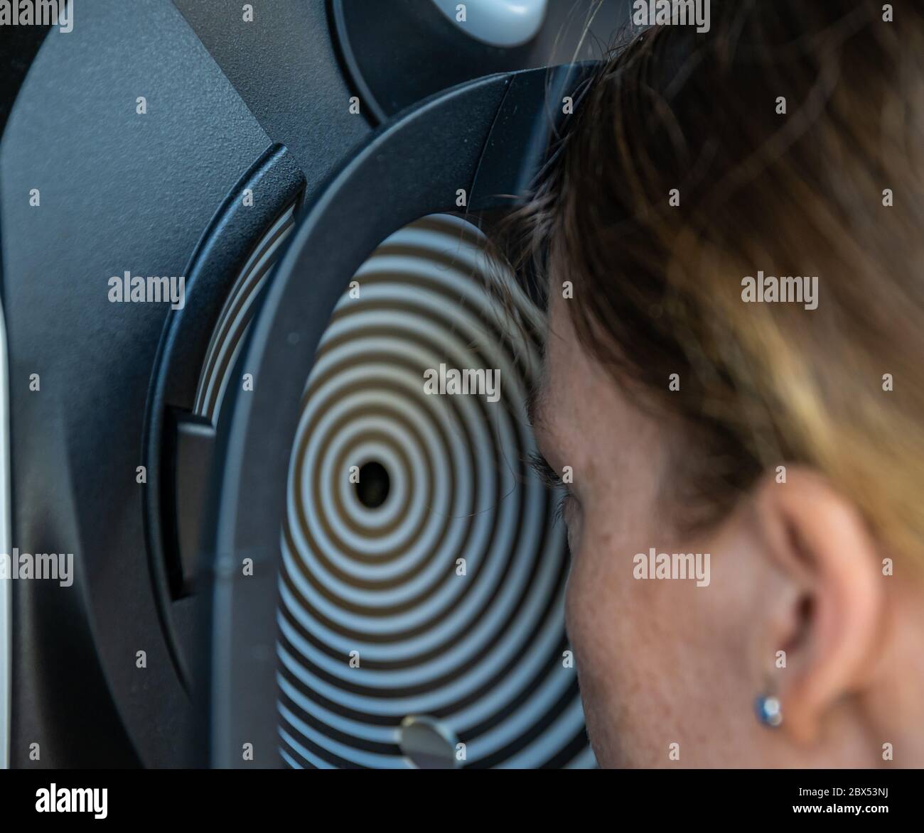 visual examination of the eyes of a young woman at the eye clinic Stock ...