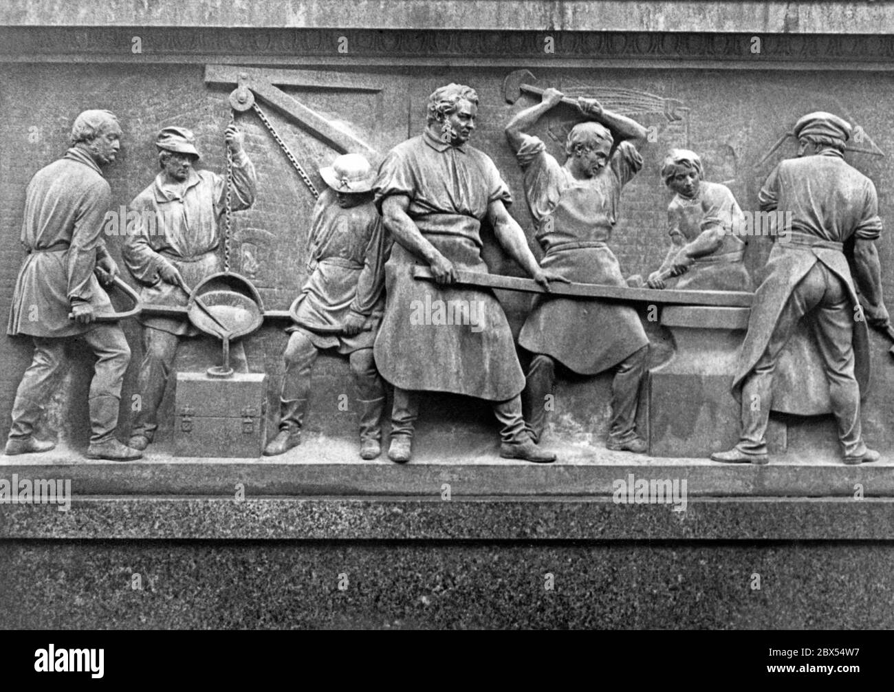 Representation of a forge and iron foundry workshop. The relief is at ...