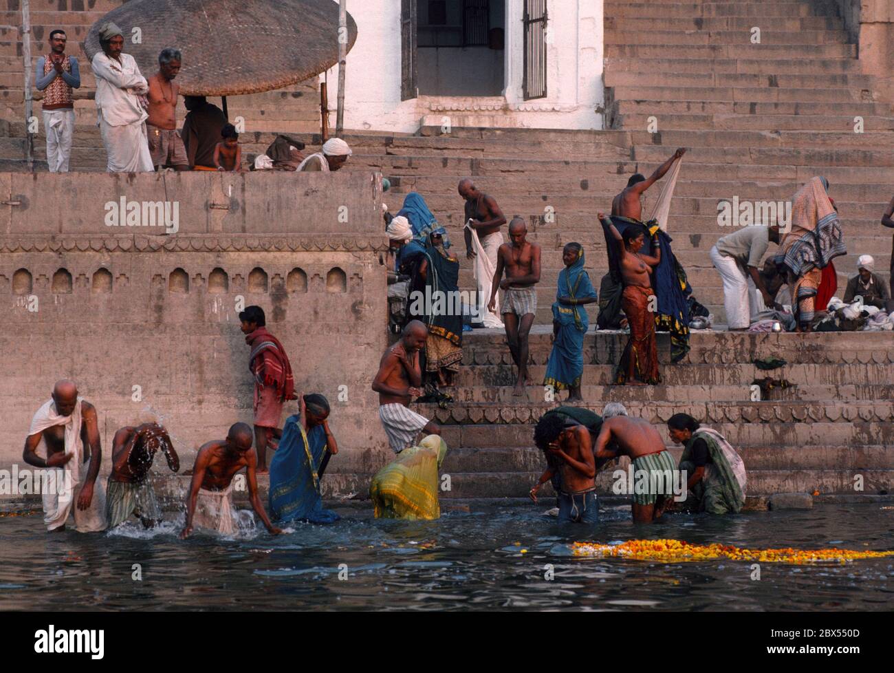 IND , INDIA : People are bathing in Ganges river in Varanasi / Benares ...