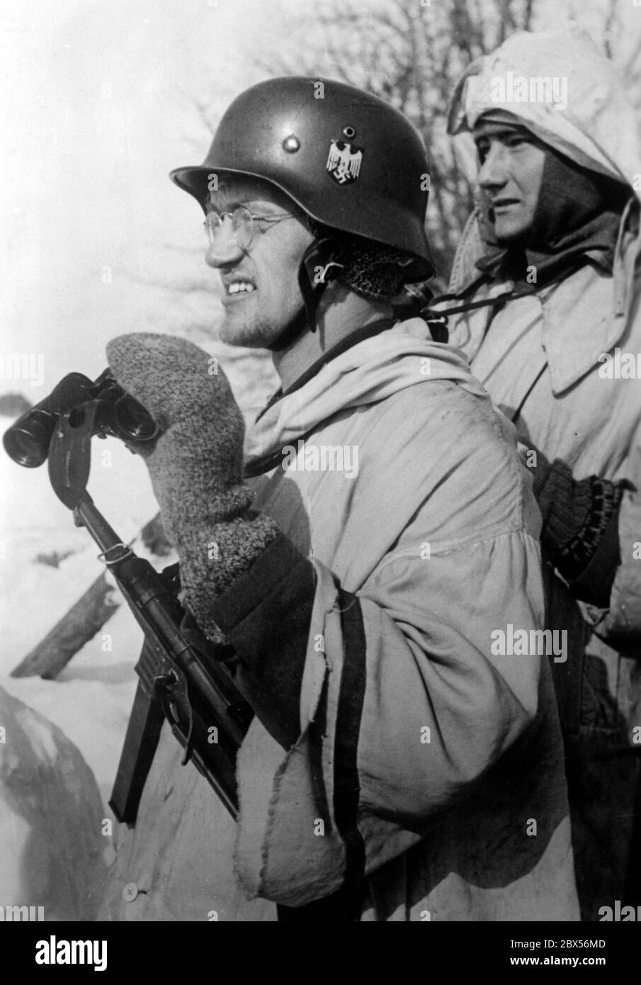 Two German soldiers, a patrol leader and a messenger behind him ...
