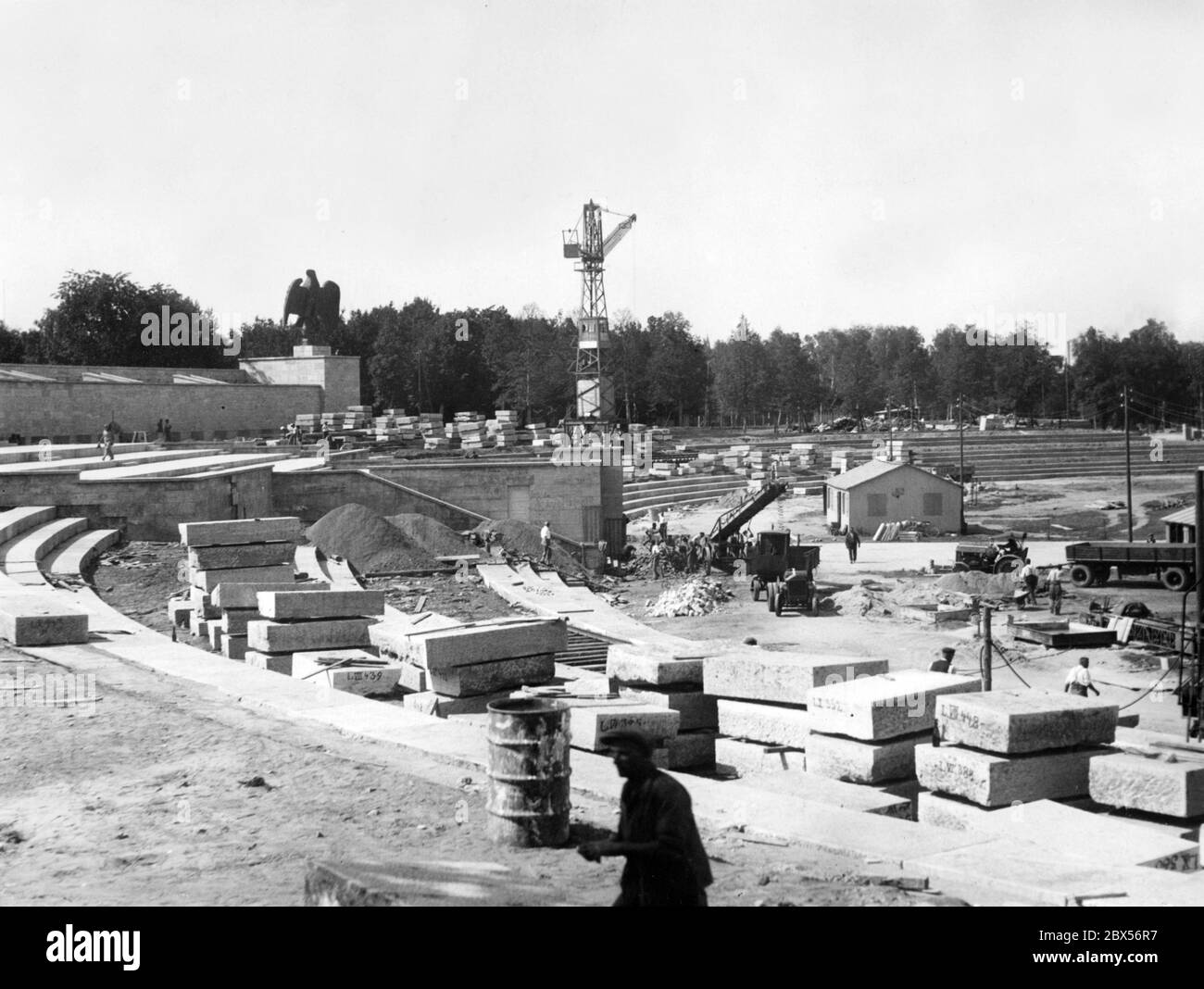 Construction workers lay out the shell limestone steps on the lawn of ...