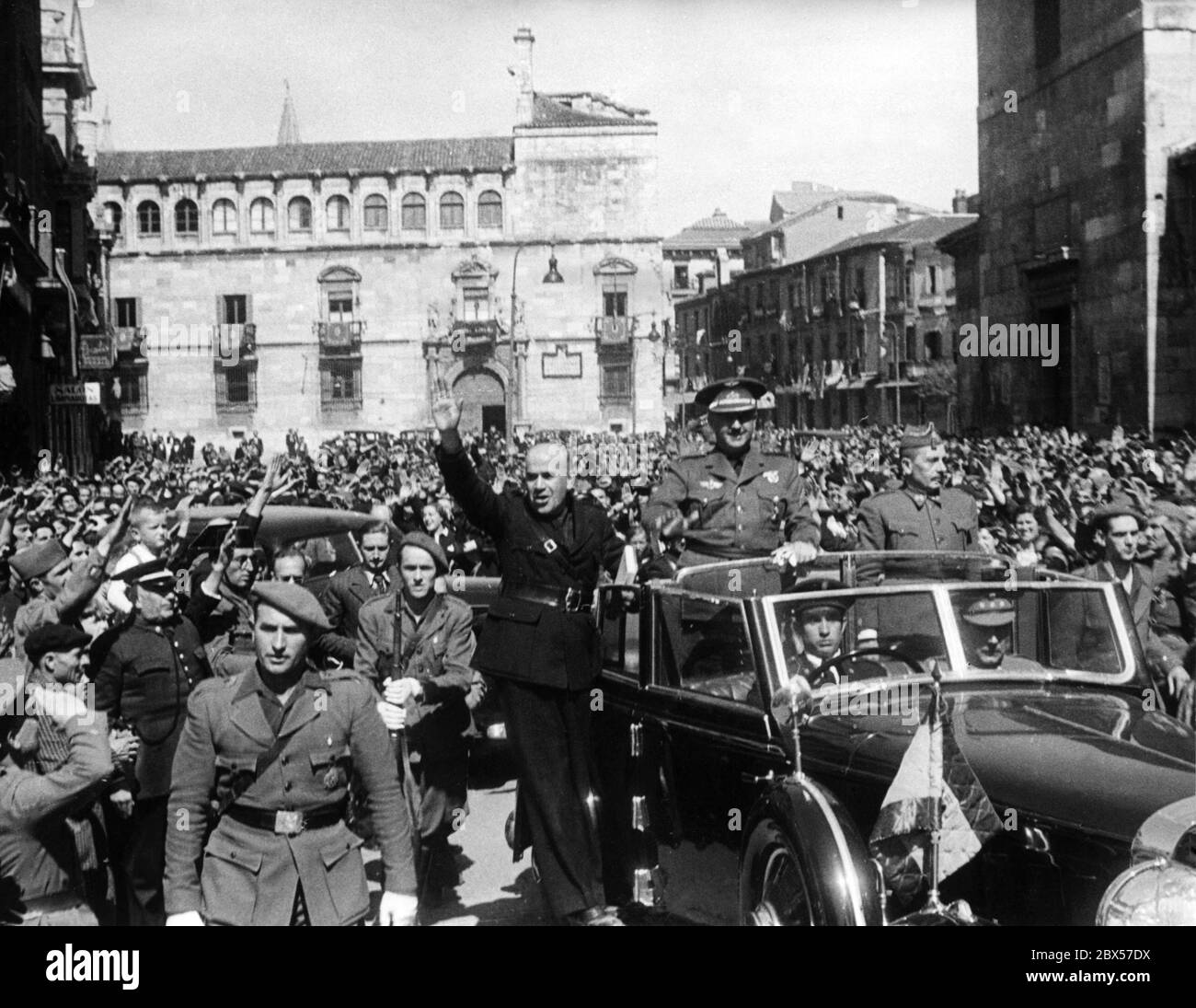 Francisco Franco (in the car on the left) enters Leon. He bids farewell ...