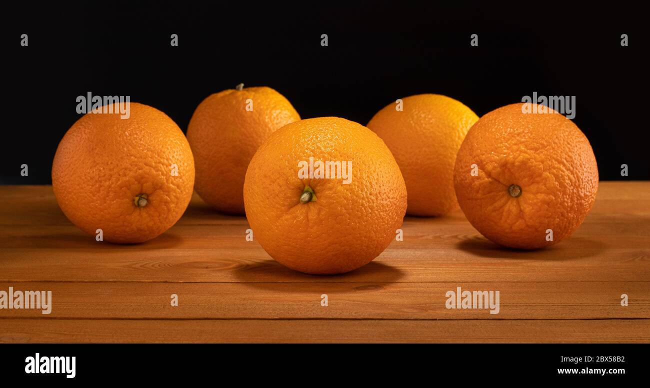 group of oranges on old rustic wood table Stock Photo - Alamy