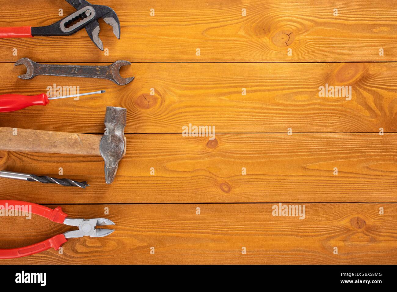 Top view layout of tools for repair on wooden background, free space ...