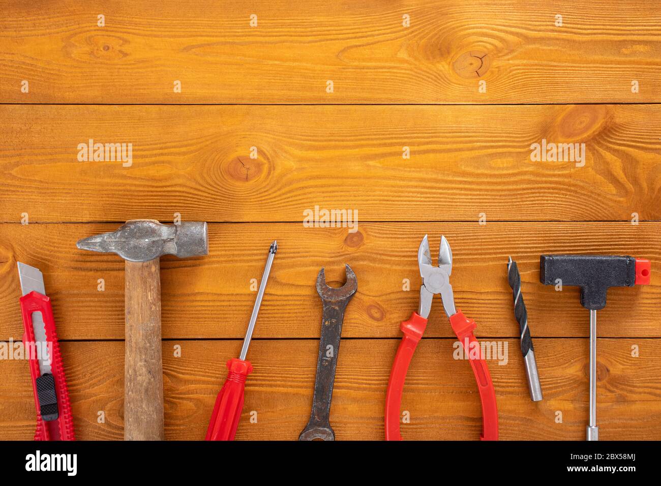Top view layout of tools for repair on wooden background, free space ...
