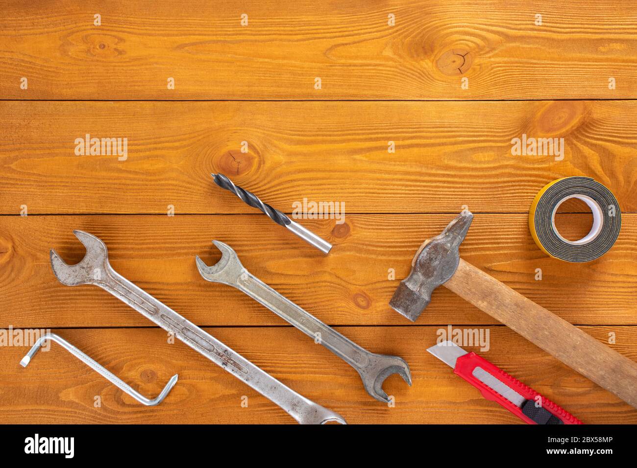 Top view layout of tools for repair on wooden background, free space ...