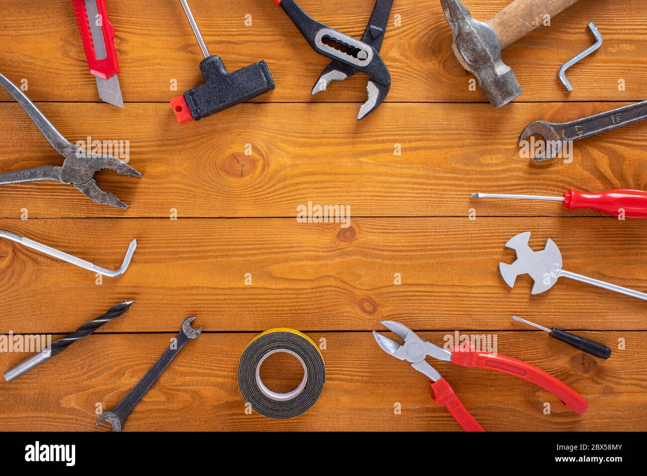 Top view layout of tools for repair on wooden background, free space ...