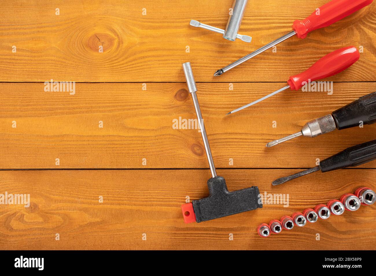 Top view layout of tools for repair on wooden background, free space ...