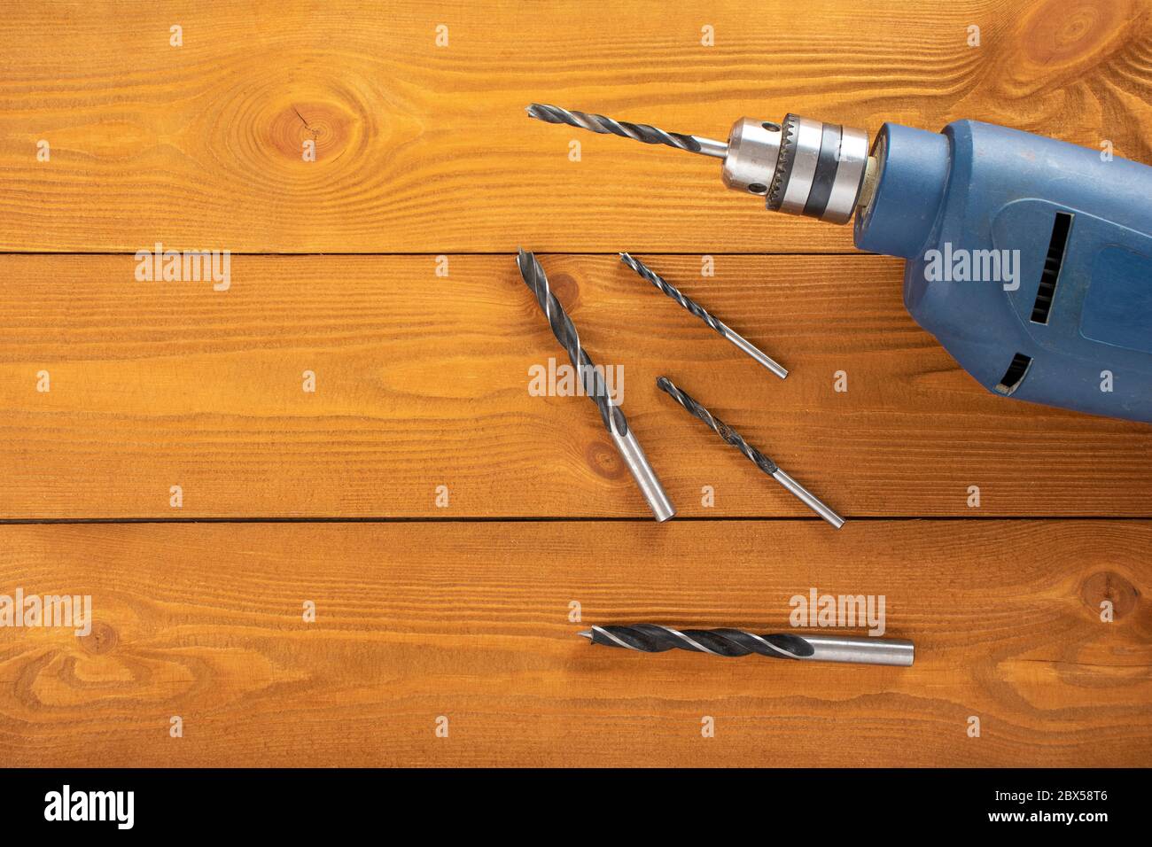 Drills and borers on wooden table, top view, free space for text Stock ...