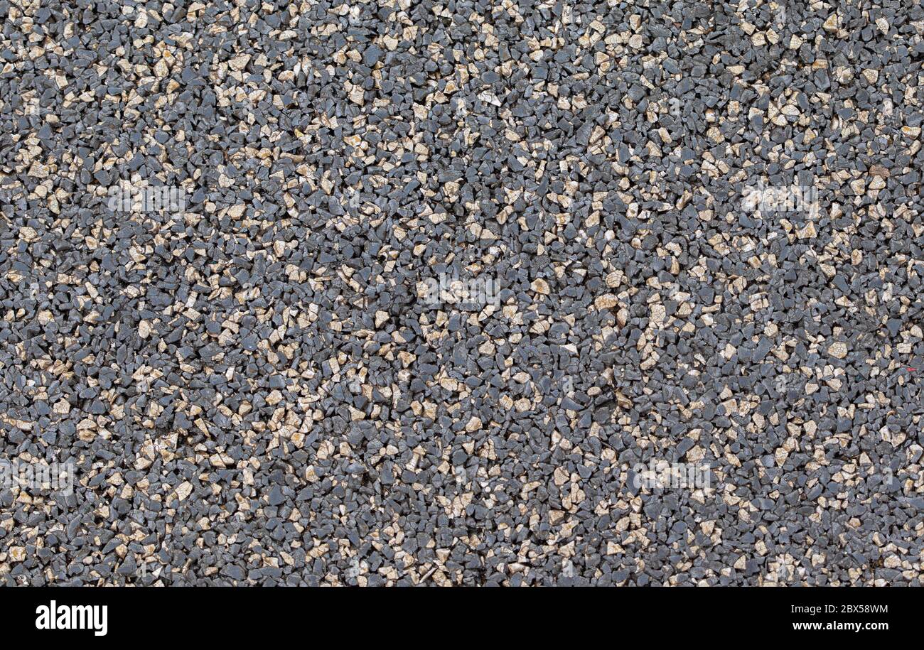 Pebble stones background, dark gravel texture close up Stock Photo - Alamy