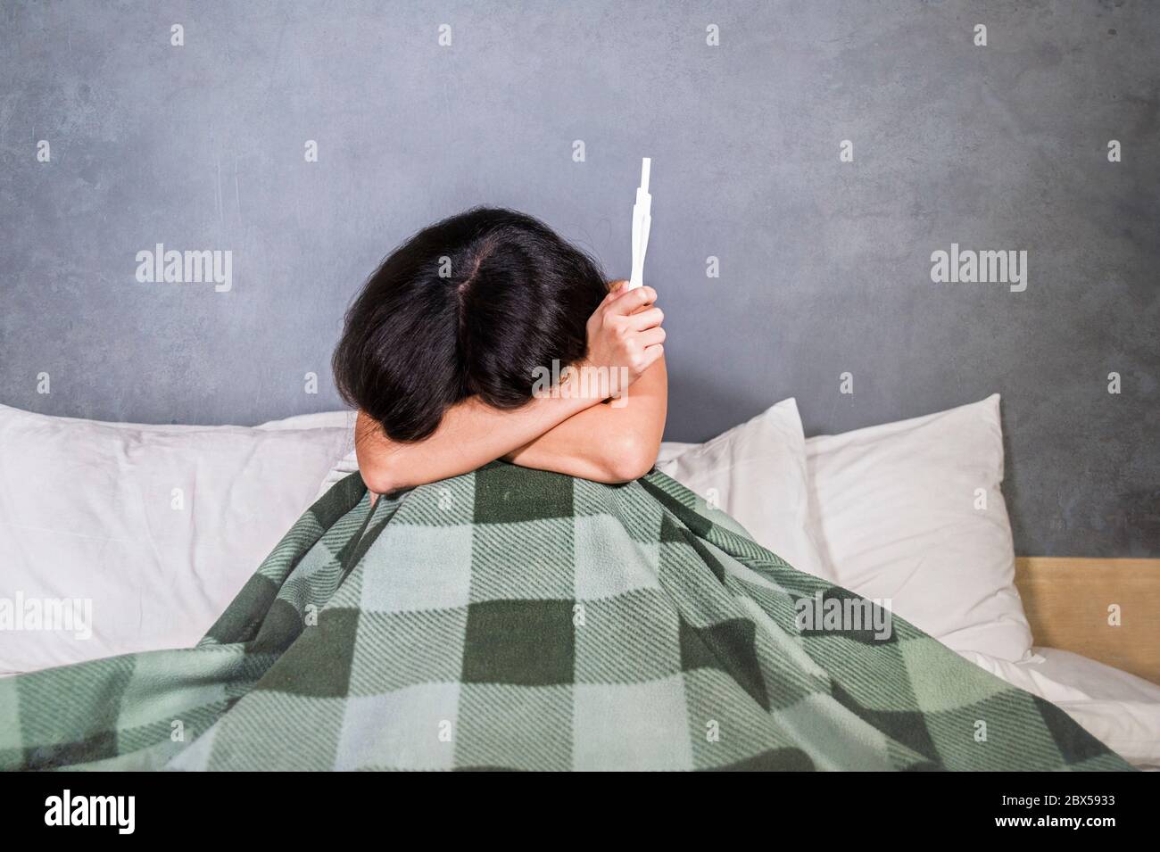 young depressed and desperate woman or teenager crying and scared ...