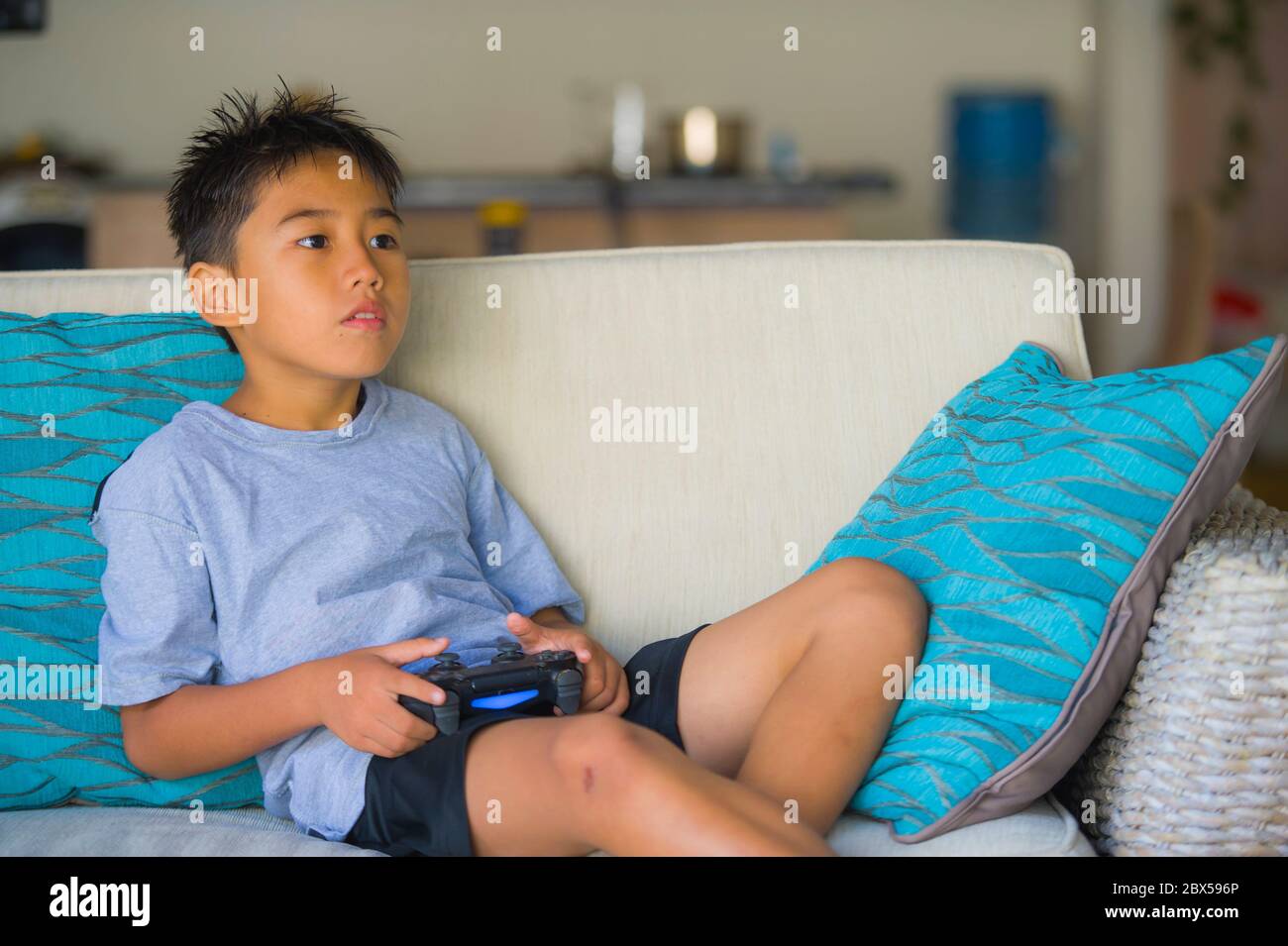 lifestyle portrait of Latin young child 8 years old excited and happy ...