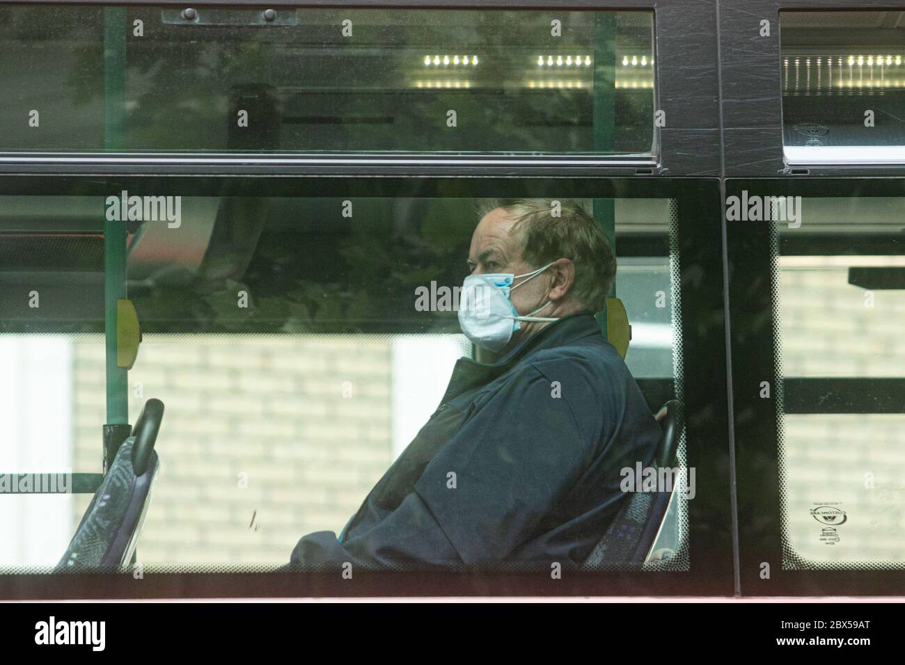 WIMBLEDON LONDON, UK. 5 June 2020. Passengers wearing a protective face ...